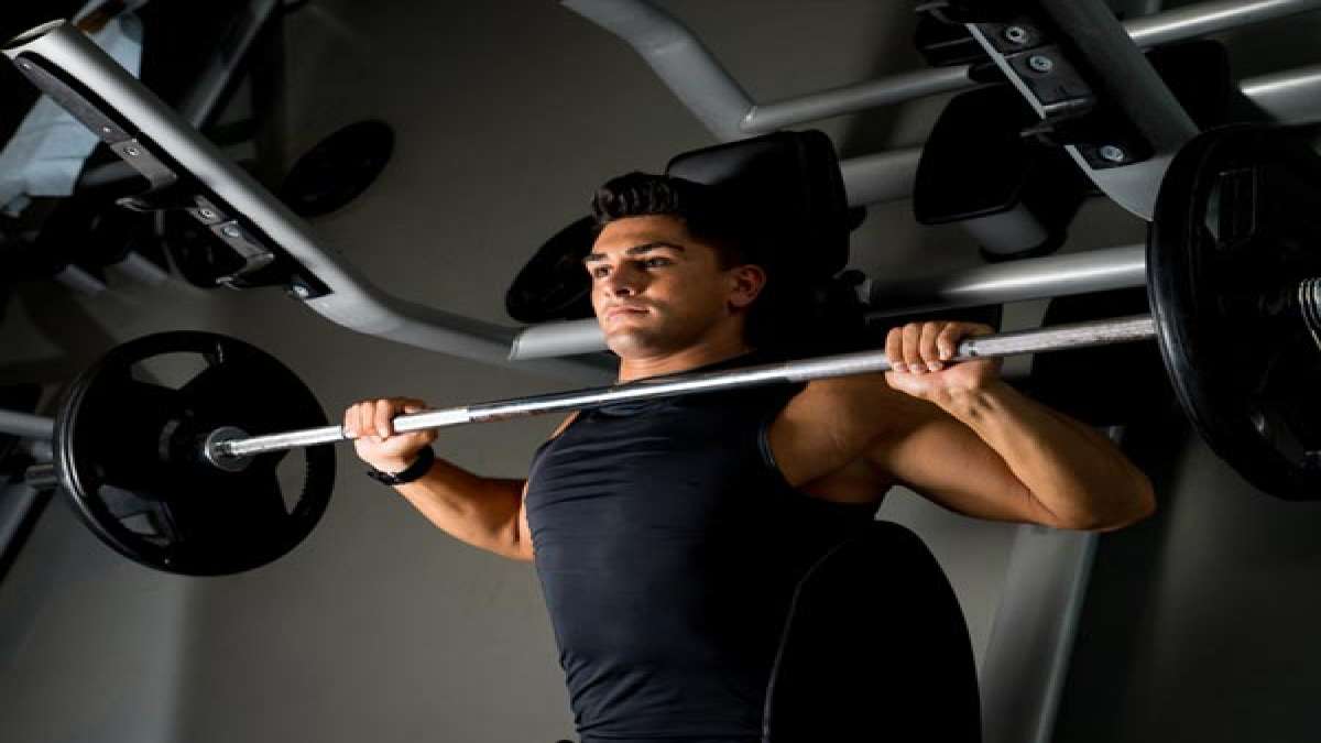 How Lifting Heavy Weight Boosts Muscle Strength - Boldsky.com